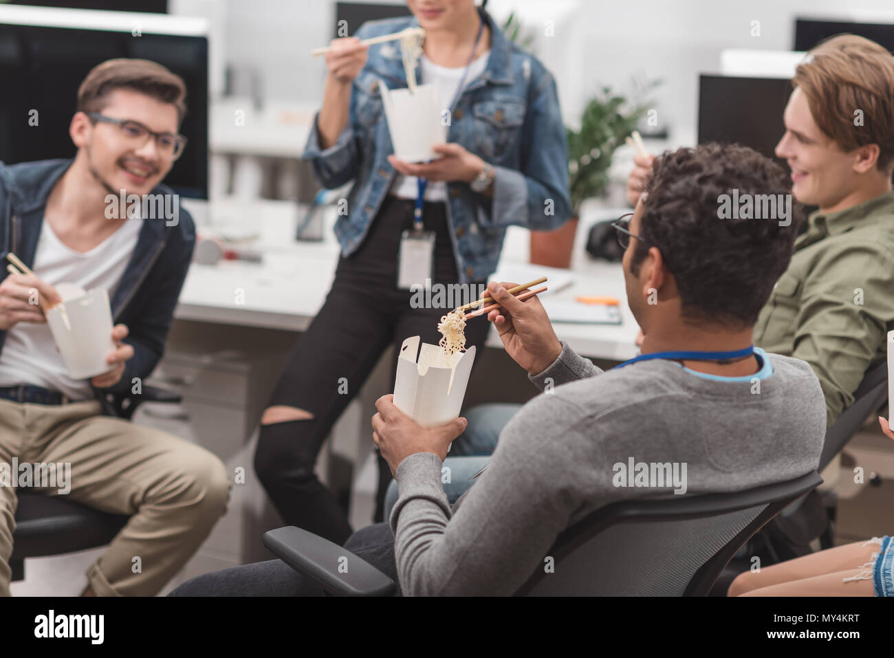 multicultural people eating thai food at modern office Stock Photo - Alamy