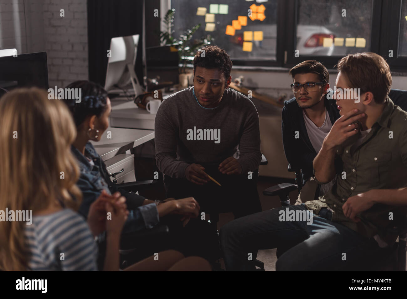 young people spending time together after work at modern office Stock ...