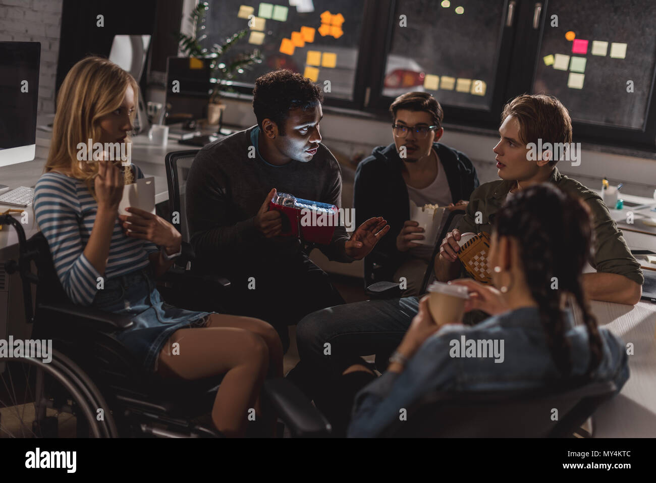 young people spending time together after work at modern office Stock ...