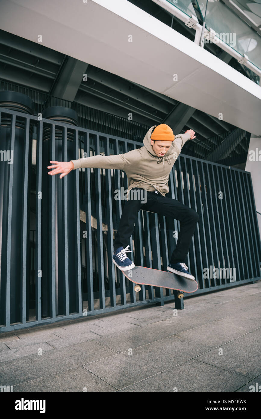 professional skateboarder performing trick in urban location Stock ...