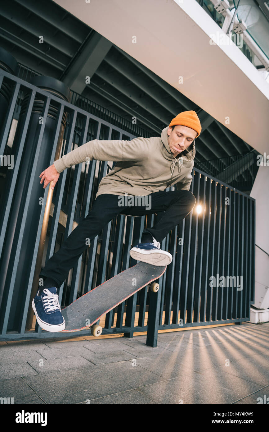 professional skateboarder performing jump trick in urban location Stock ...