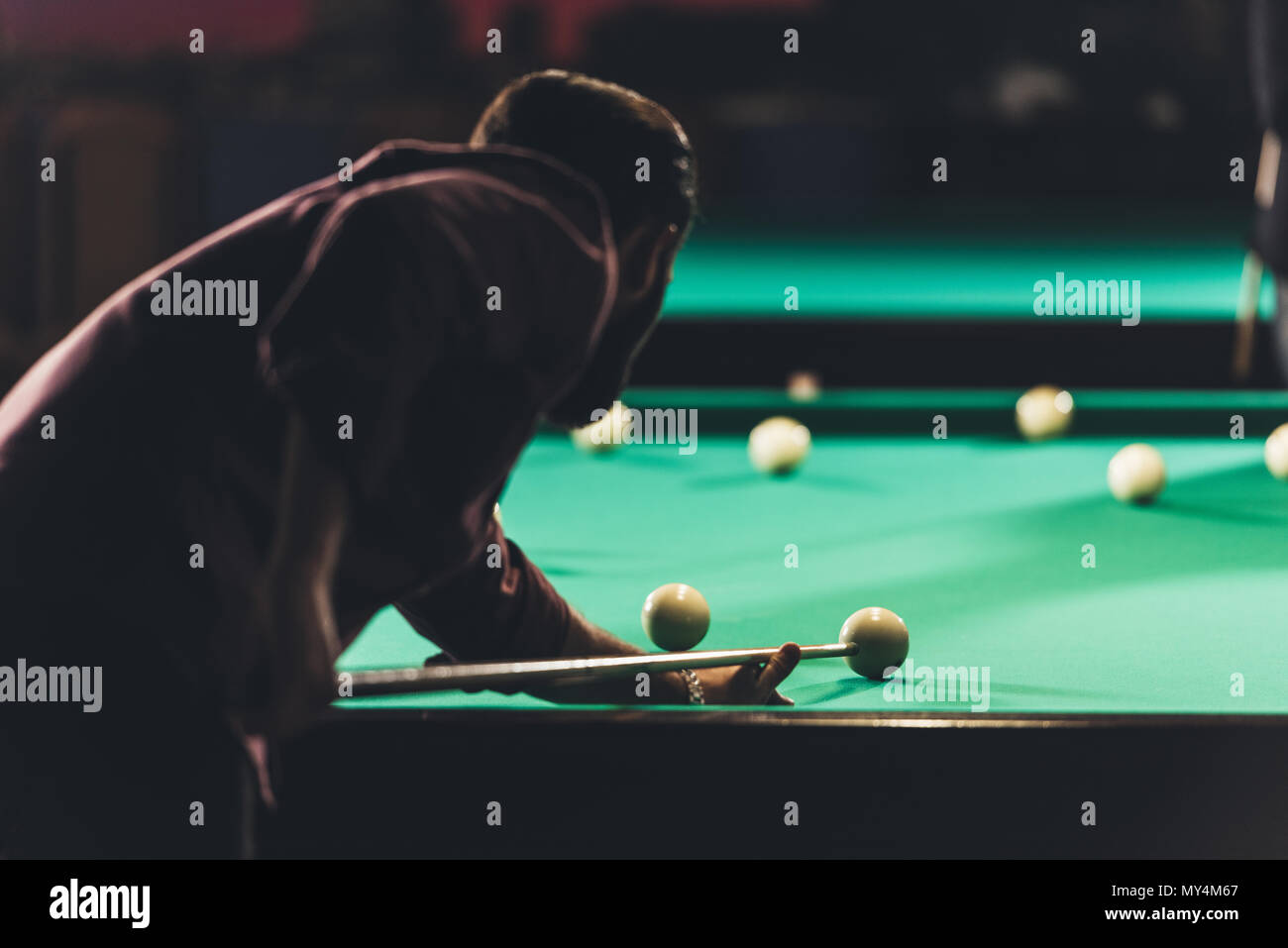 back view of man playing in russian pool at bar Stock Photo - Alamy