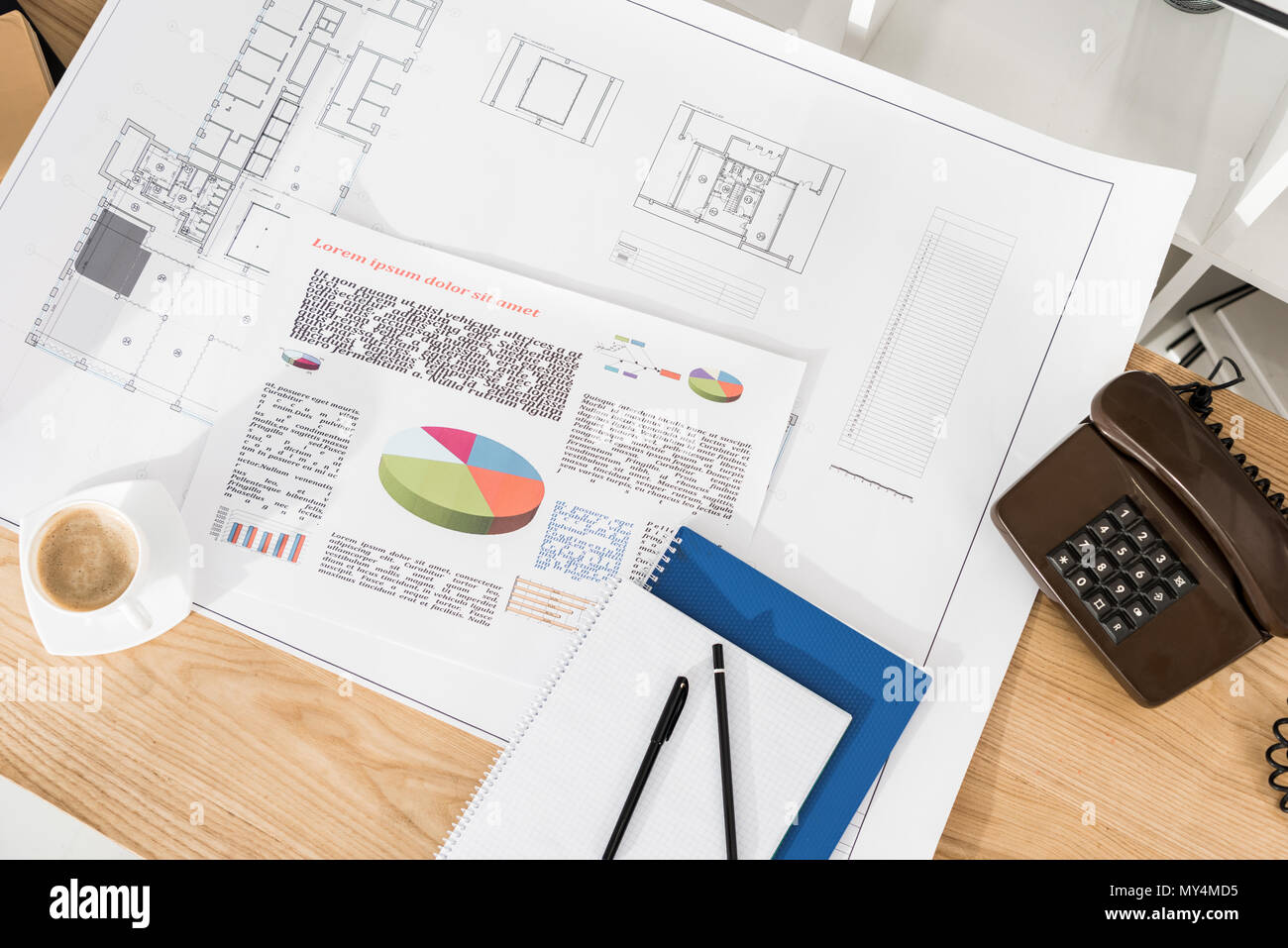 top view of blueprints and plans on wooden table Stock Photo - Alamy