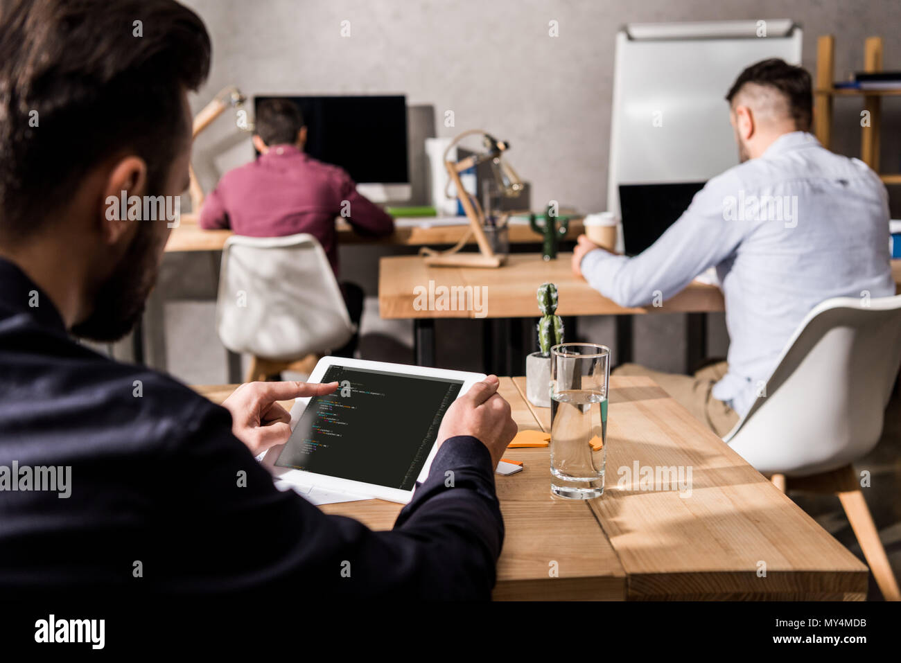 businessman holding tablet with loading system Stock Photo - Alamy