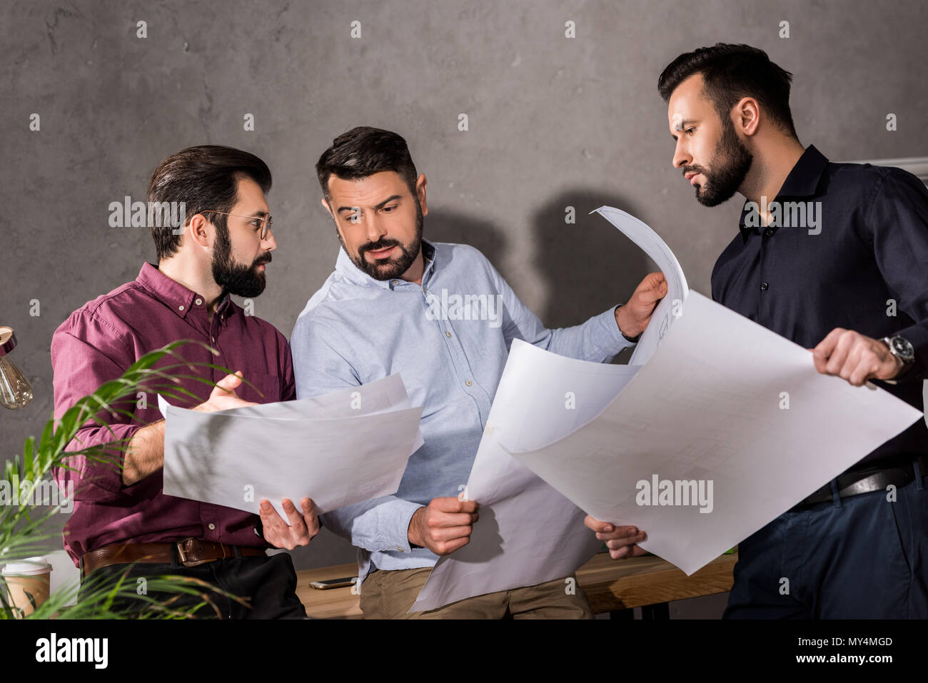Looking at blueprints hi-res stock photography and images - Alamy