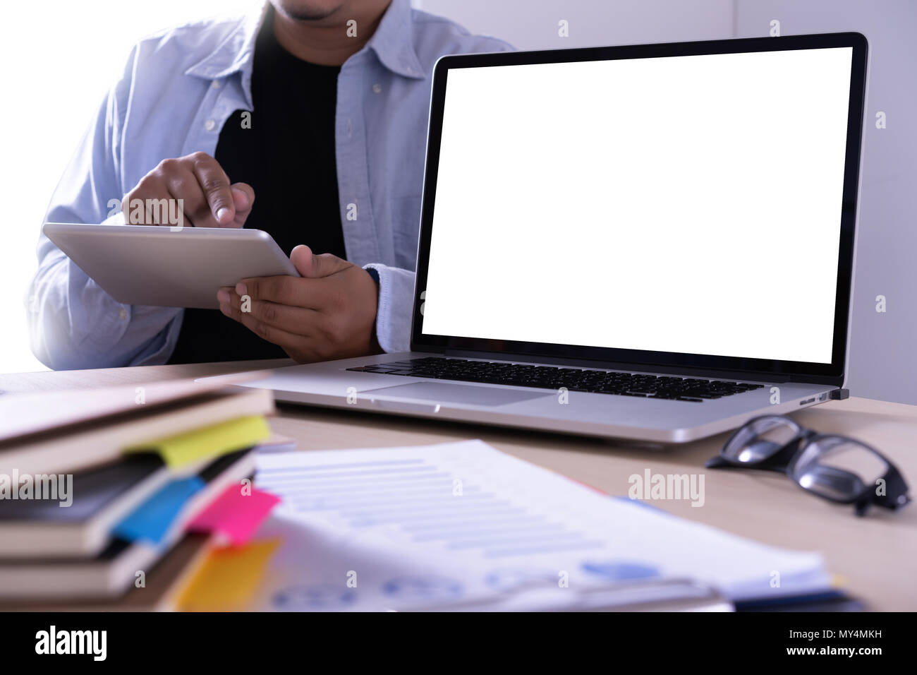 Laptop with blank screen on table. Workspace background new project on ...