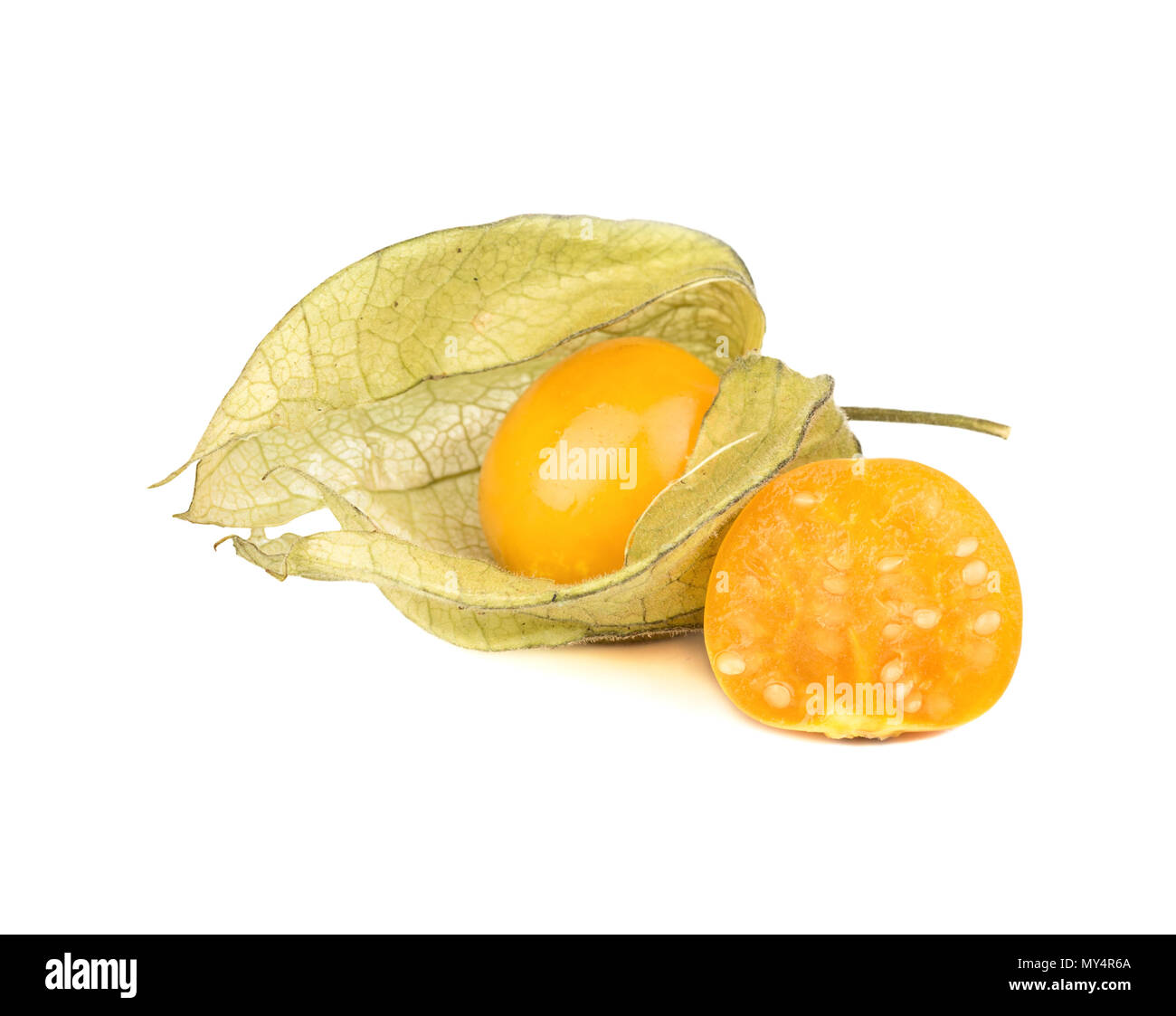 Fresh fruit physalis in the husk with a juicy half on a white ...