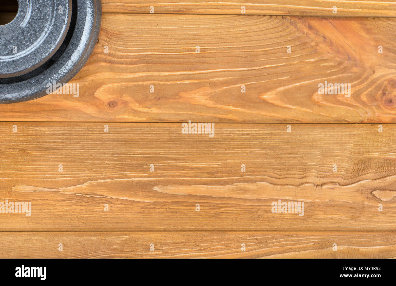 Part weight plates on an empty wooden background, top view Stock Photo ...