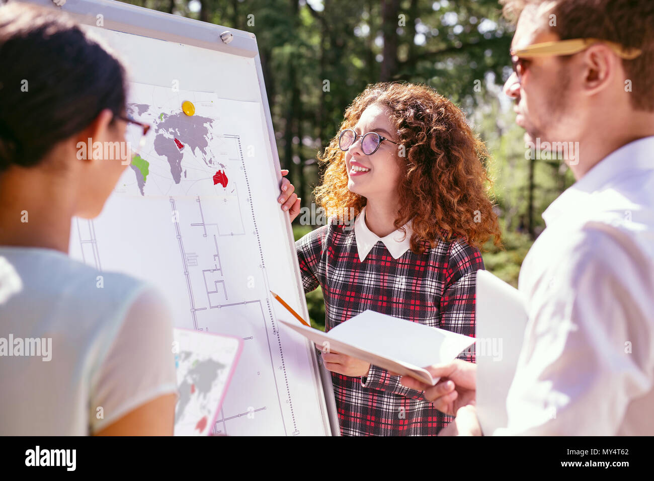 Joyful female student presenting her project Stock Photo - Alamy