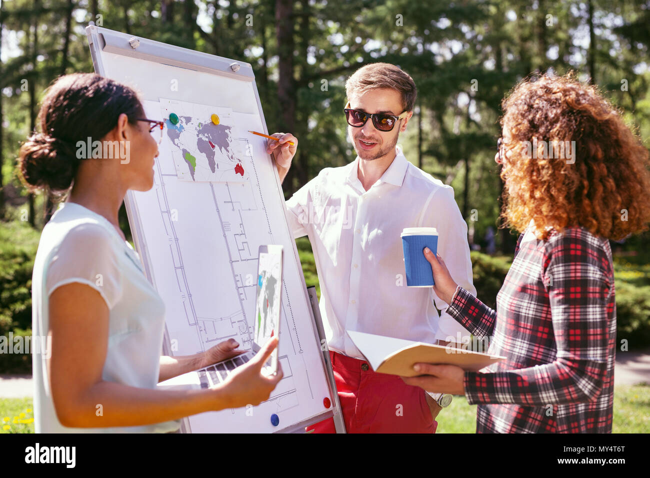 Concentrated students doing their homework project Stock Photo - Alamy