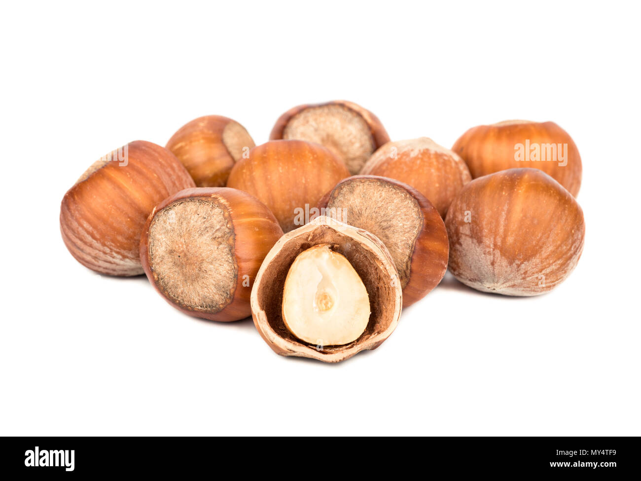 Pile of hazelnuts in shell, and a half on a white background Stock ...