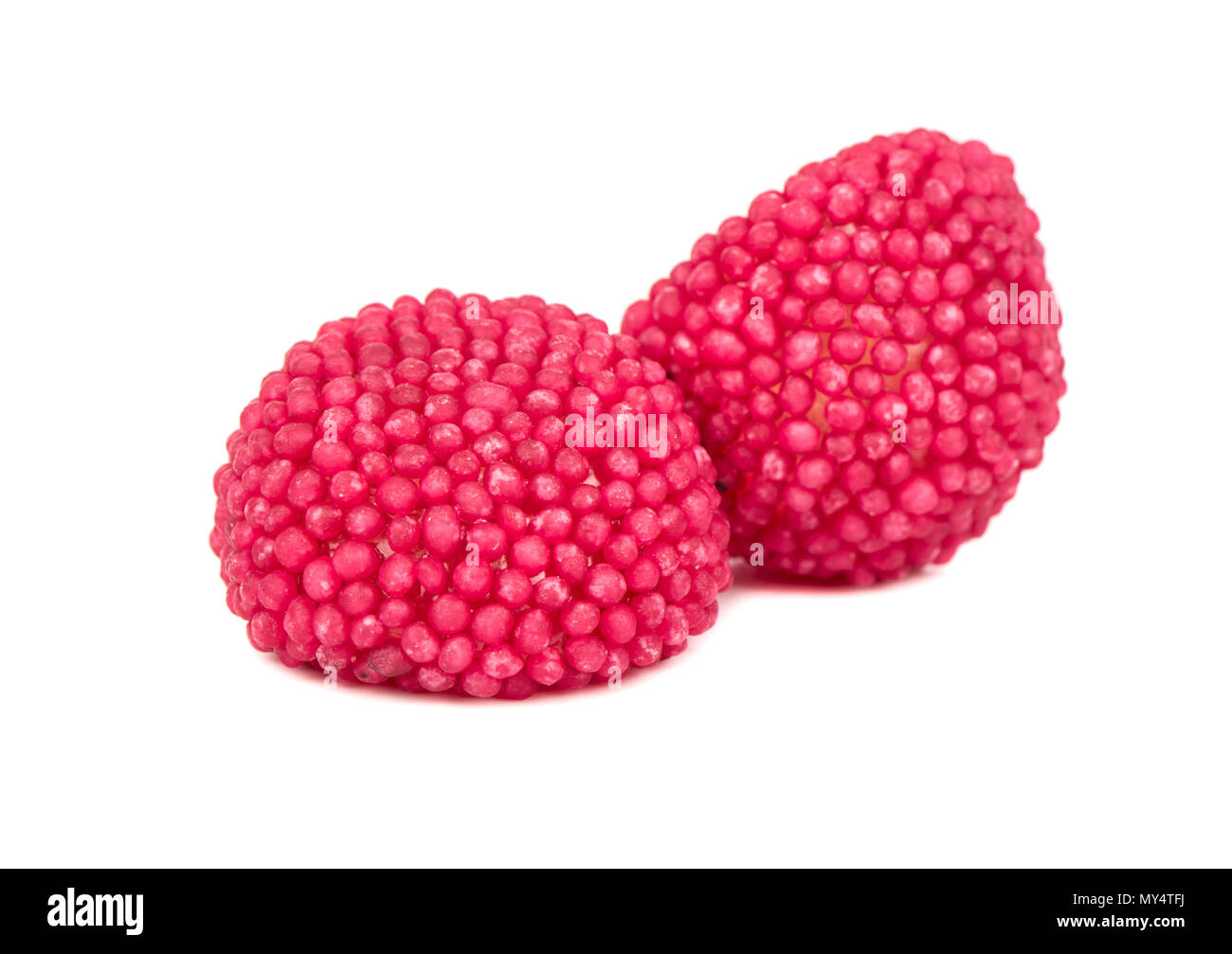 Two red berry jelly candies on a white background Stock Photo - Alamy