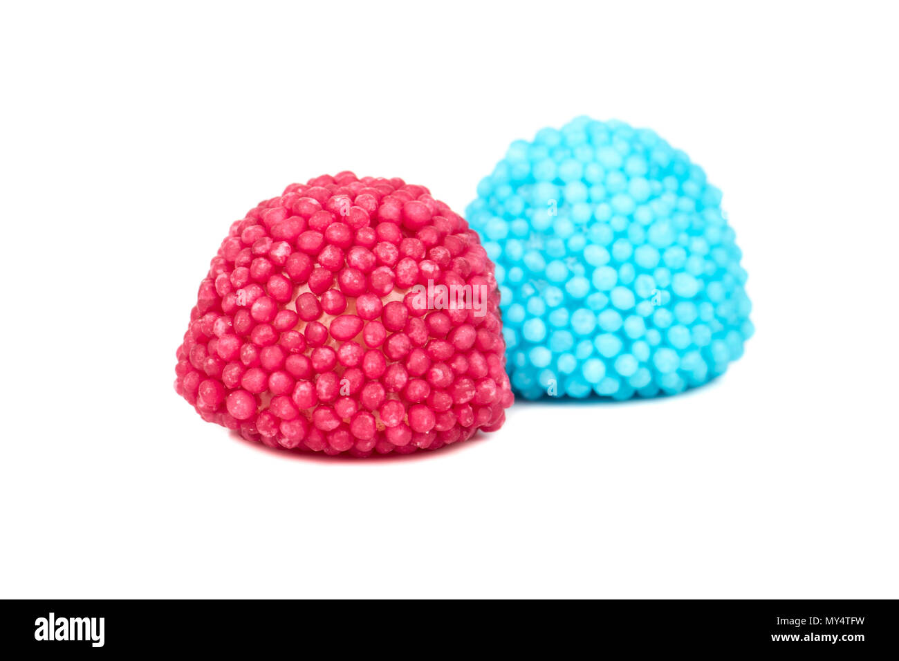 Blue and red berry jelly candy on a white background Stock Photo - Alamy