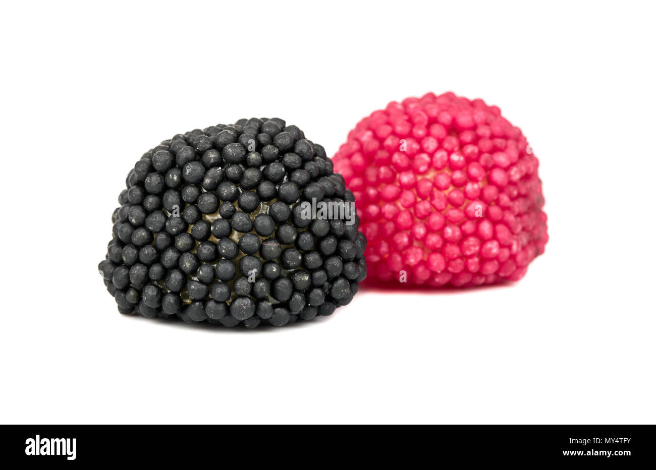 Black and red berry jelly candy on a white background Stock Photo - Alamy