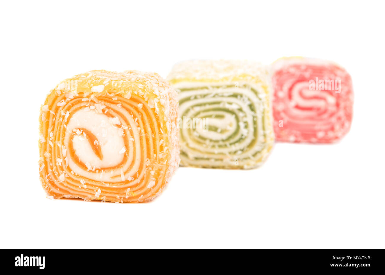 Three colored turkish delight isolated on white background Stock Photo ...