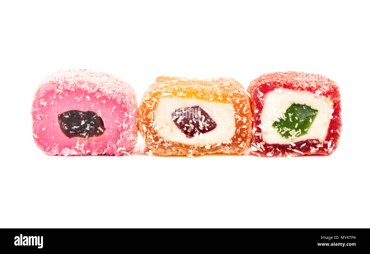 Three colored turkish delight on white background Stock Photo - Alamy