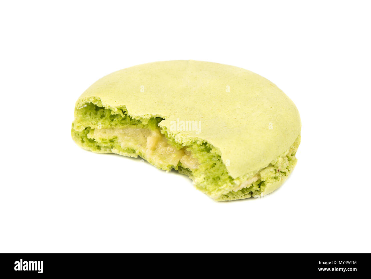 Bitten pistachio macaroon isolated on white background Stock Photo - Alamy