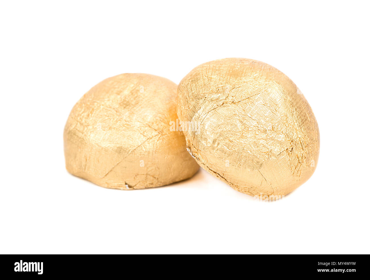 Two chocolates in gold wrapping isolated on white background Stock ...