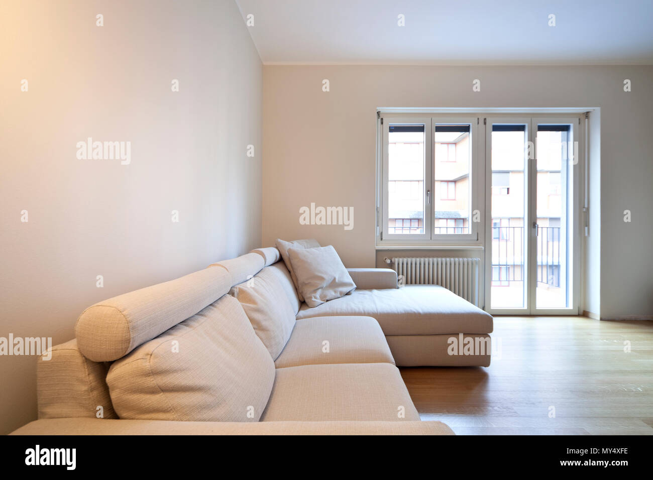 bright modern apartment, angle sofa Stock Photo - Alamy