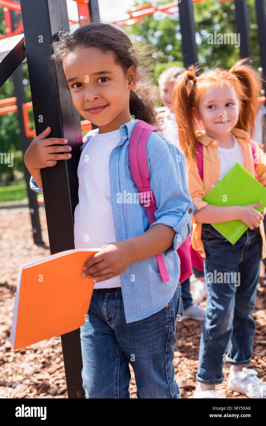 Girls holding books hi-res stock photography and images - Alamy