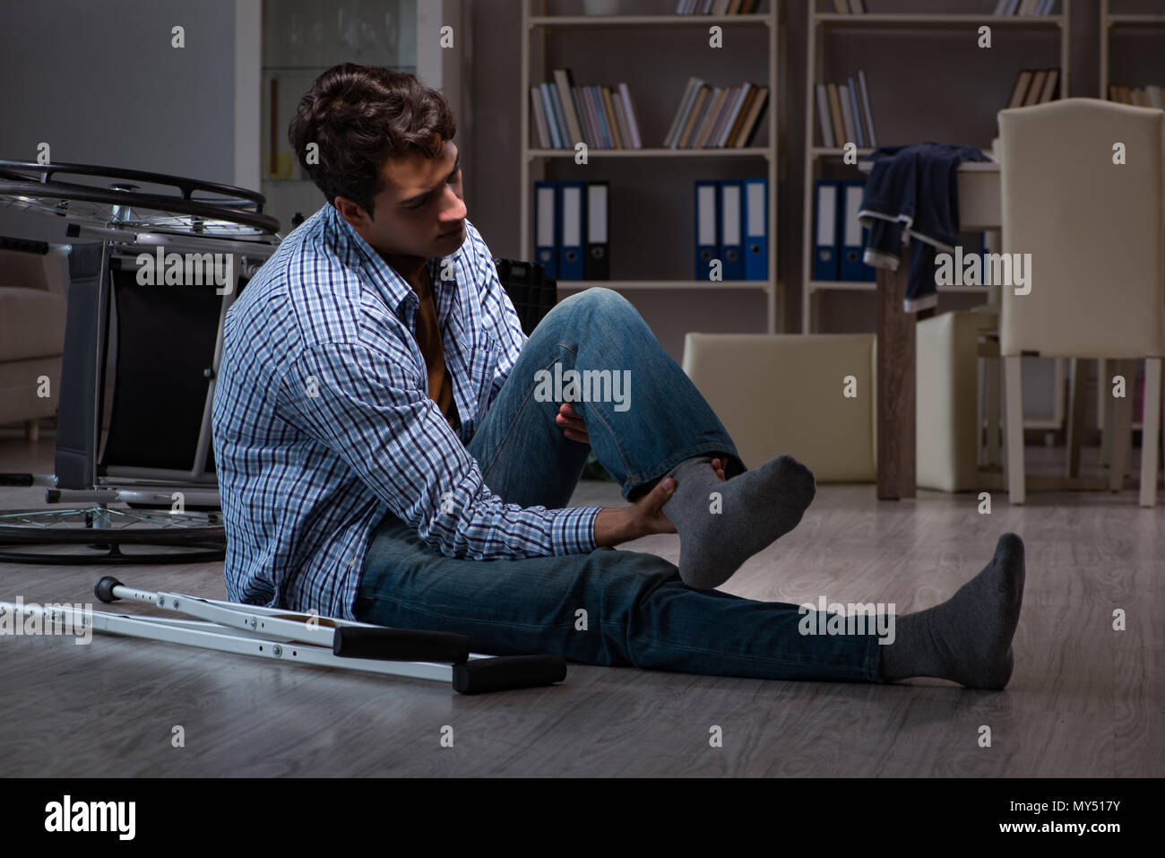 Man falling off chair hi-res stock photography and images - Alamy