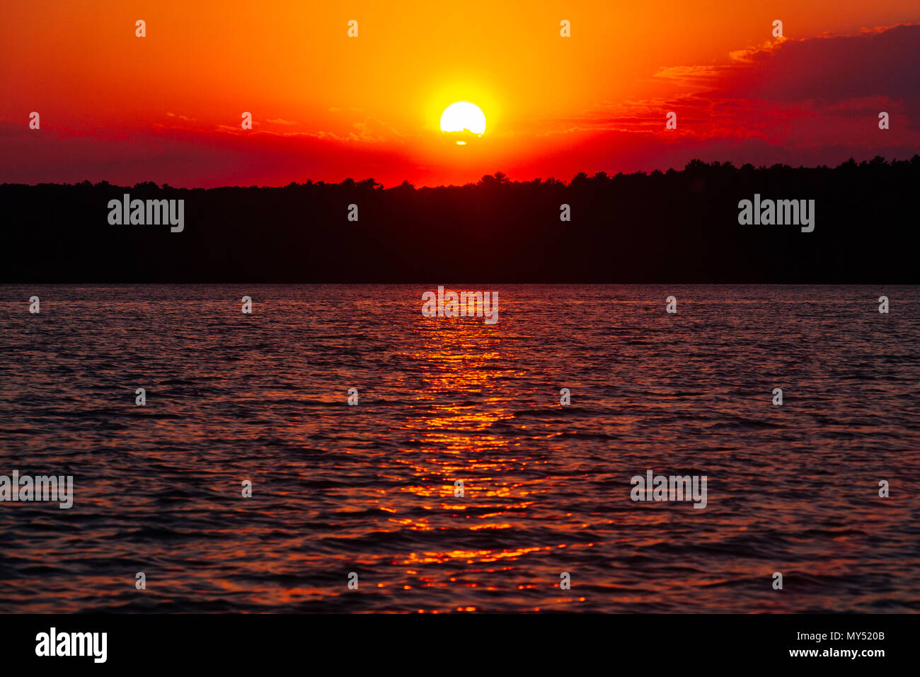Bright orange sunset over Lake Superior and the Apostle Islands ...
