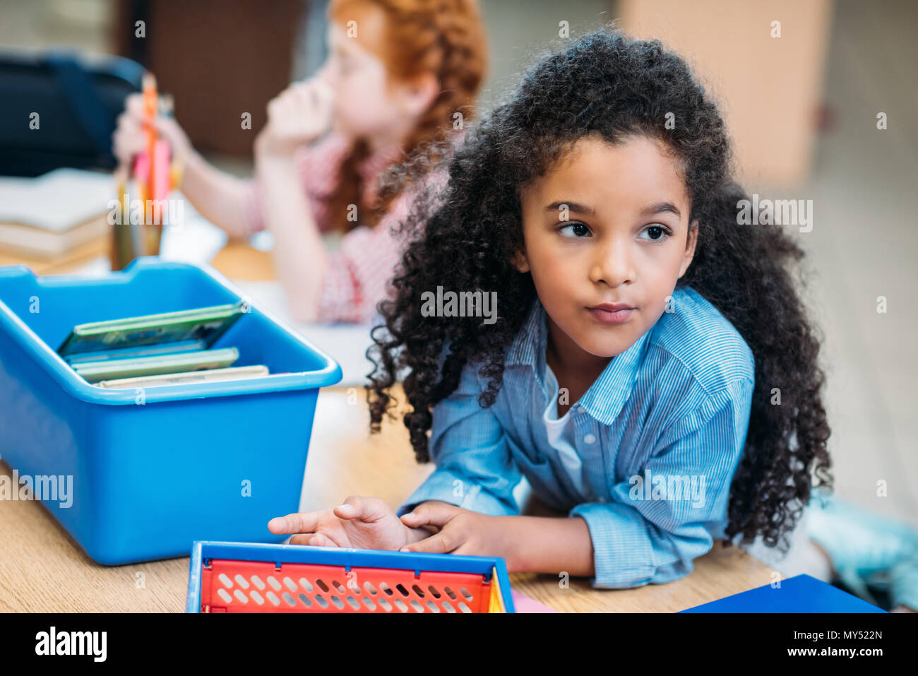 African girl with books hi-res stock photography and images - Alamy
