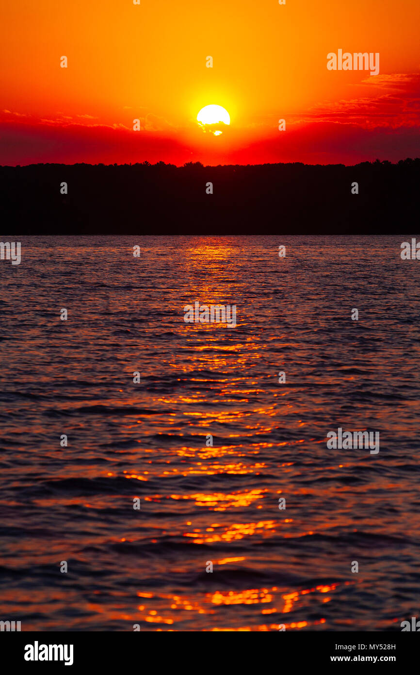 Bright orange sunset over Lake Superior and the Apostle Islands ...