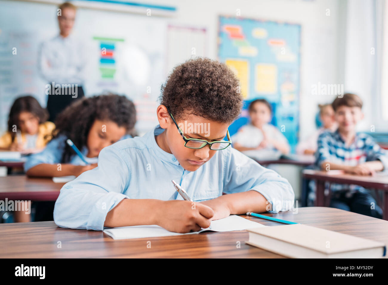 African schoolboy writing hi-res stock photography and images - Alamy