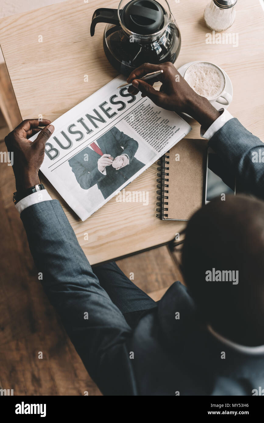 Business newspaper overhead hi-res stock photography and images - Alamy