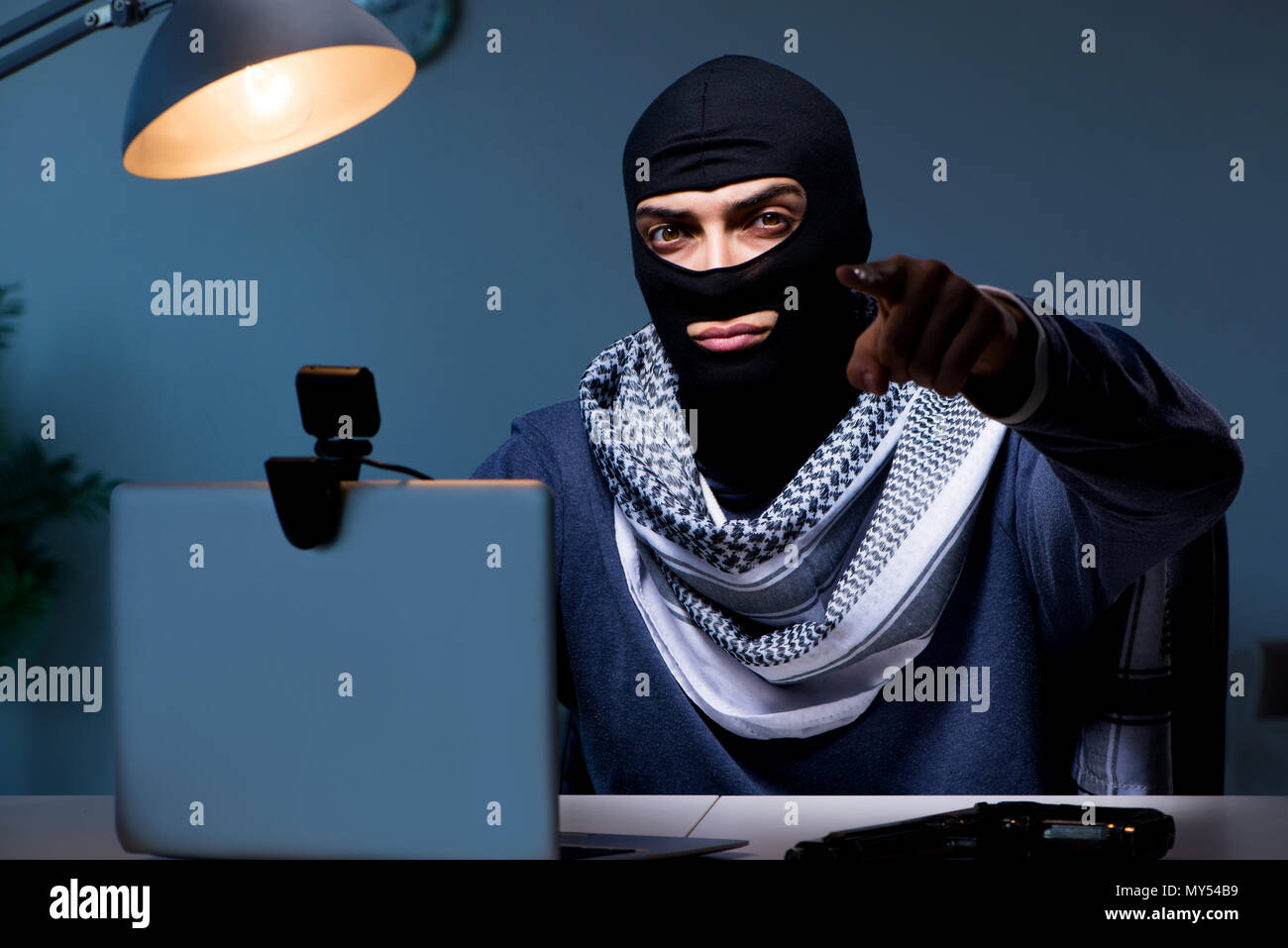 Hacker wearing balaclava mask hacking computer Stock Photo - Alamy