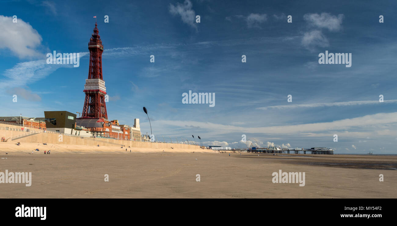 Blackpool, England, UK - August 1, 2015: Tourists walk along the sands ...