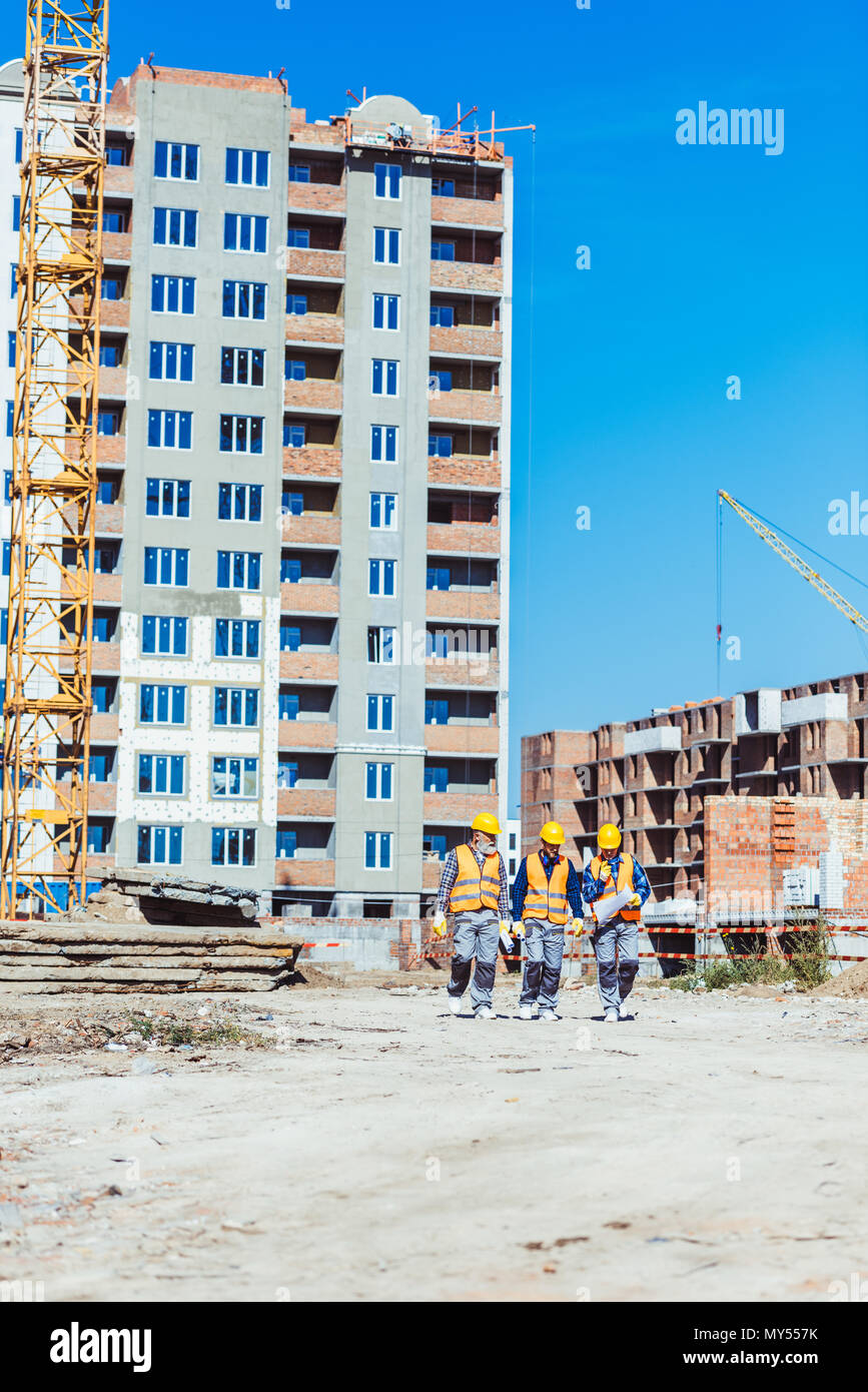 Three builders hi-res stock photography and images - Alamy
