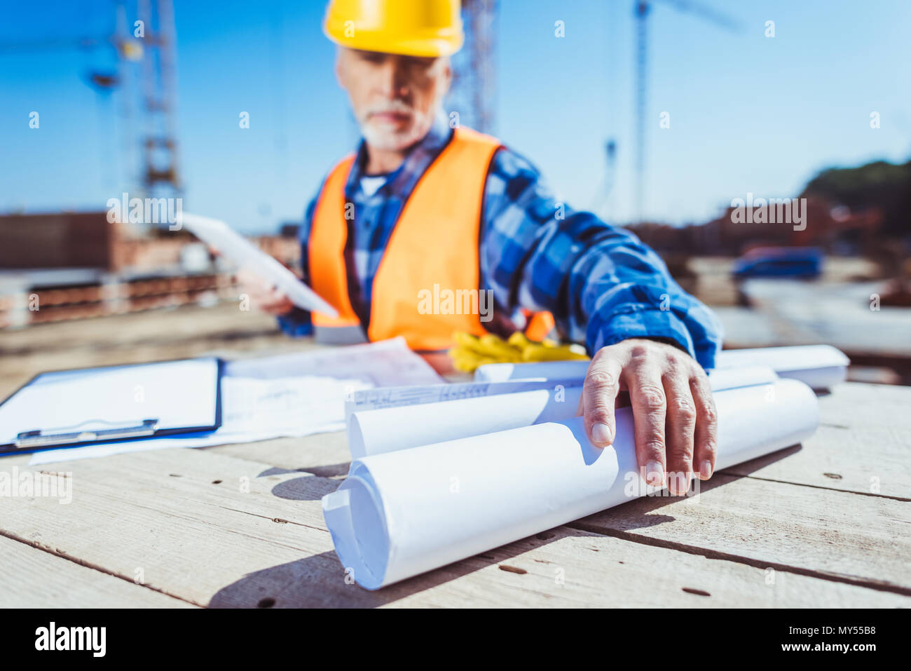 Construction holding building plans hi-res stock photography and images ...