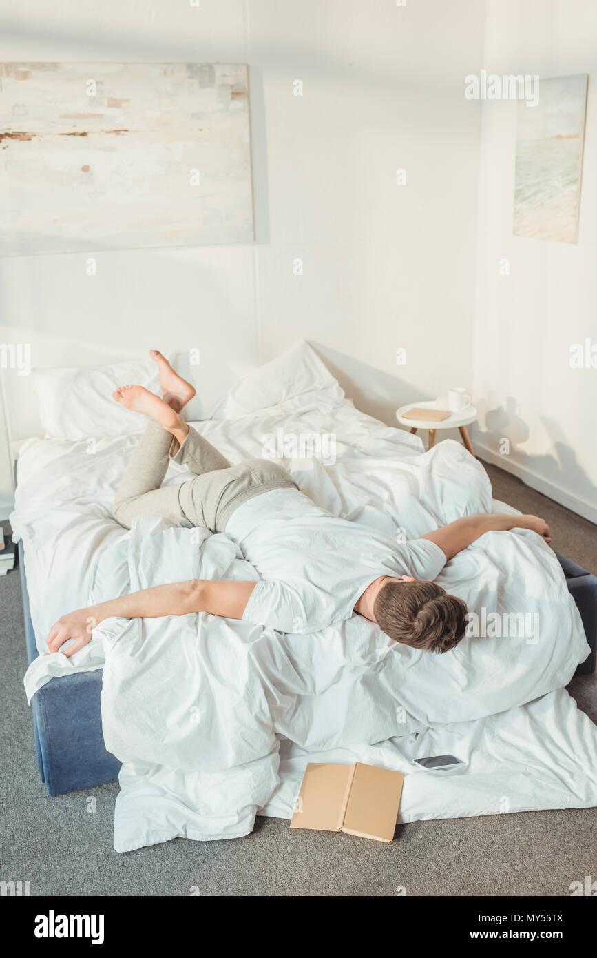 Man relaxing in bed hi-res stock photography and images - Alamy