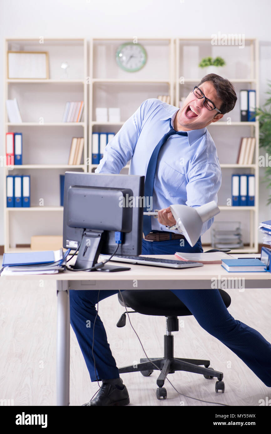 Angry businessman frustrated with too much work Stock Photo - Alamy