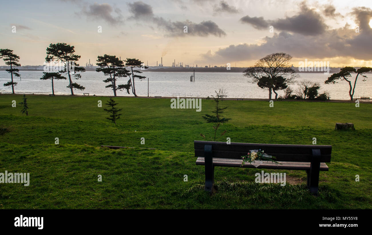 The sunset silhouettes the industrial towers of Fawley oil refinery and ...