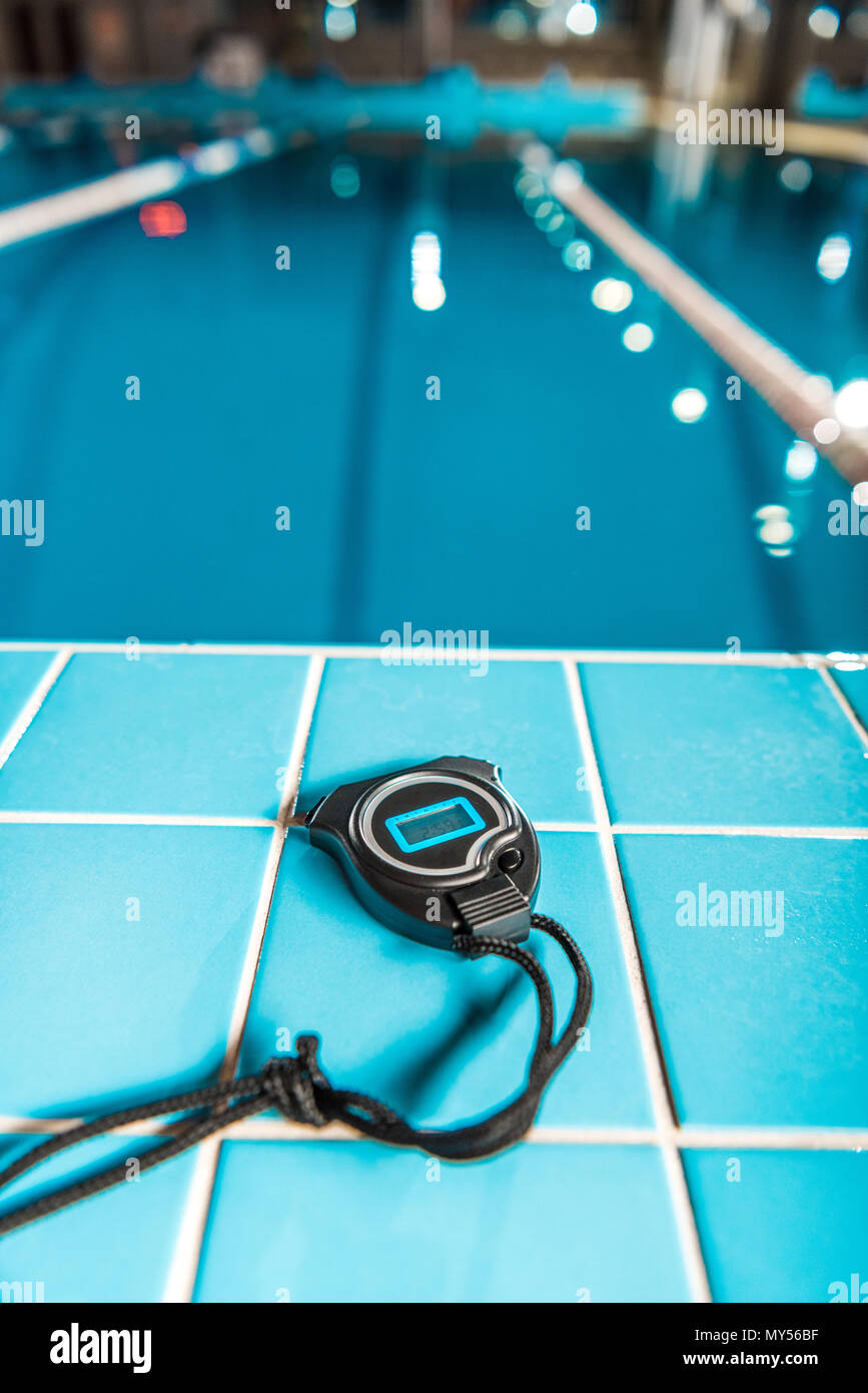stopwatch lying at competition swimming pool Stock Photo - Alamy