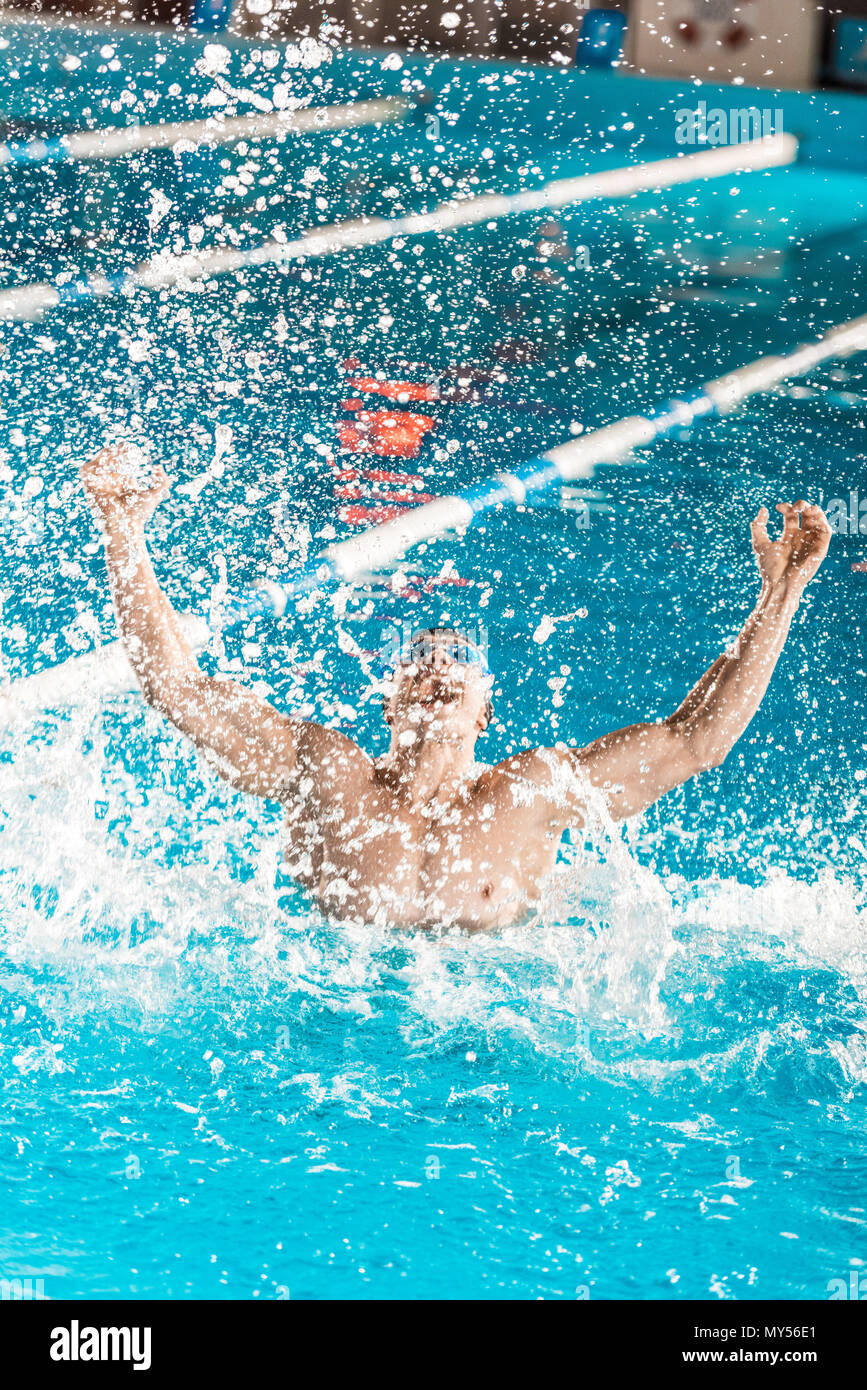 handsome winning muscular swimmer in competition swimming pool Stock ...
