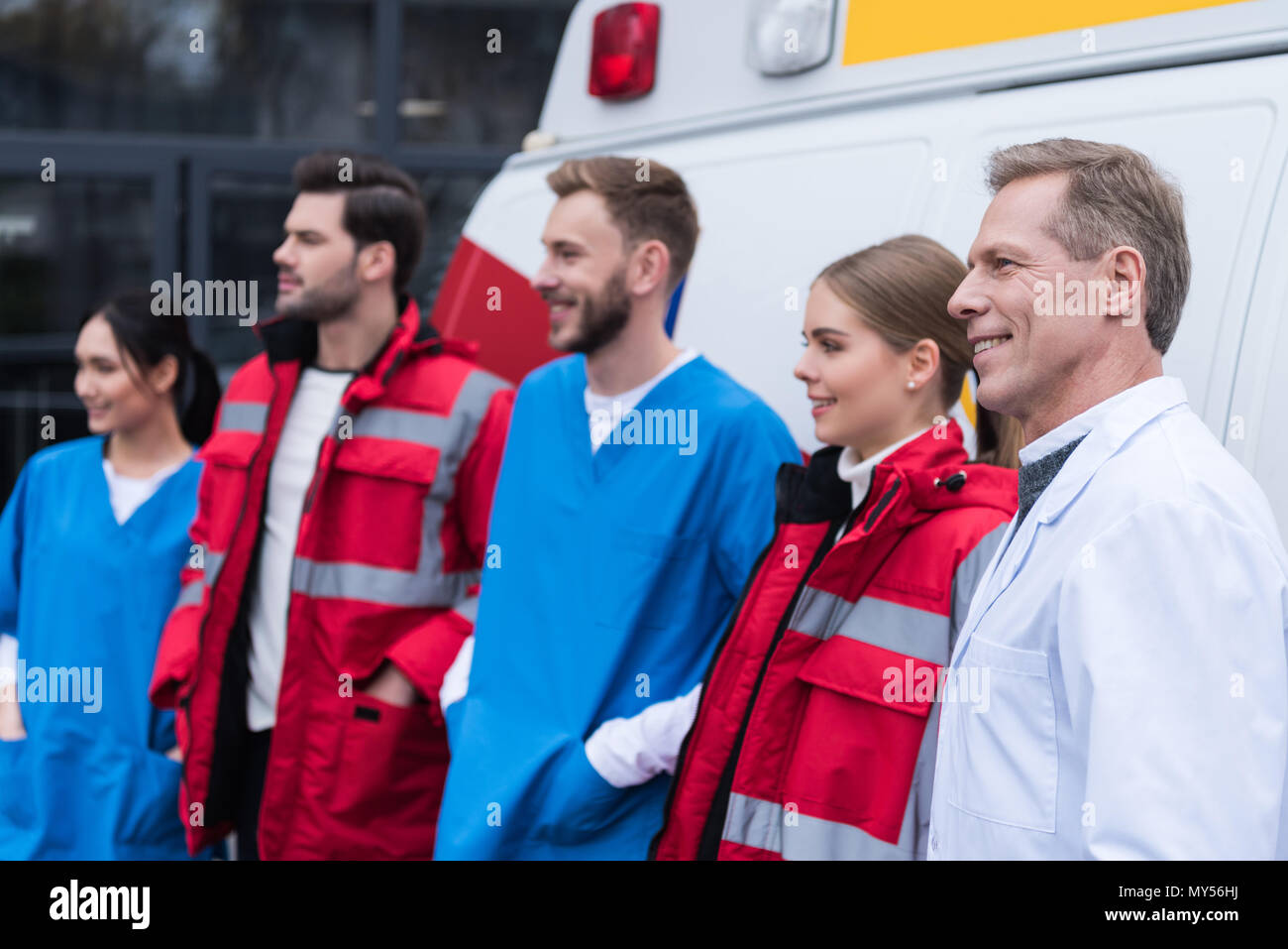 ambulance doctors working team smiling and standing in front of car ...