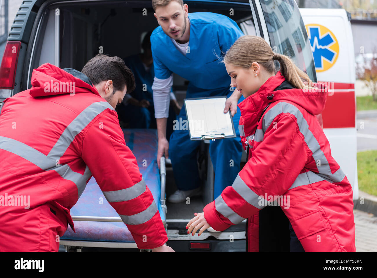 Paramedics help young man hi-res stock photography and images - Alamy