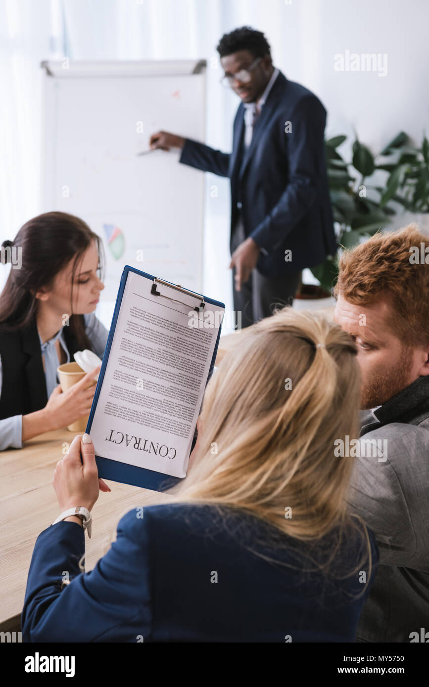 group of businesspeople having conversation at office conference hall ...