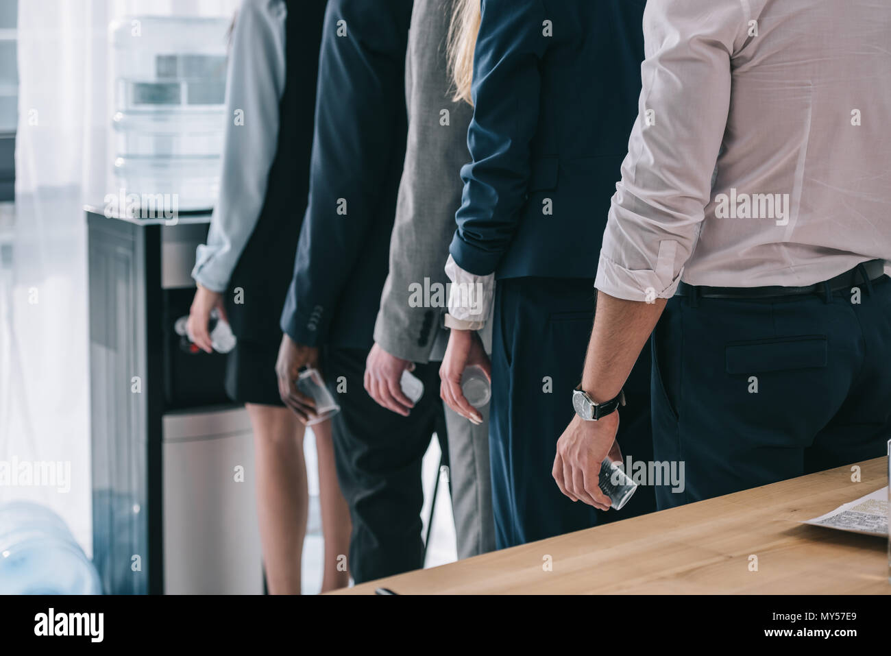 People standing for water queue hi-res stock photography and images - Alamy