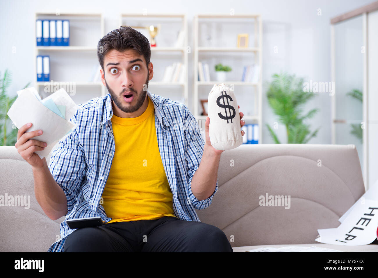 Man angry at bills he needs to pay Stock Photo - Alamy