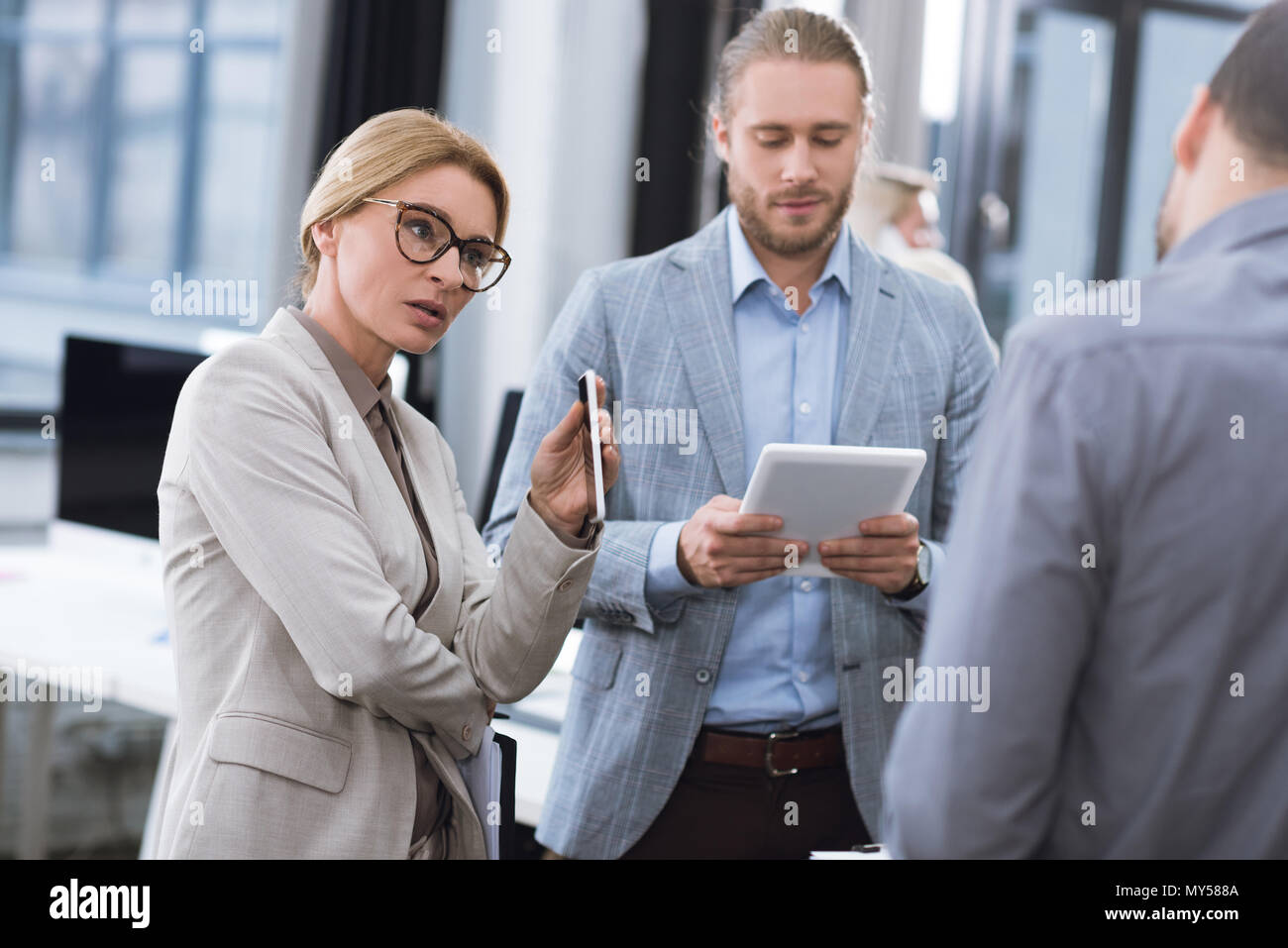 Business colleagues having discussion hi-res stock photography and ...