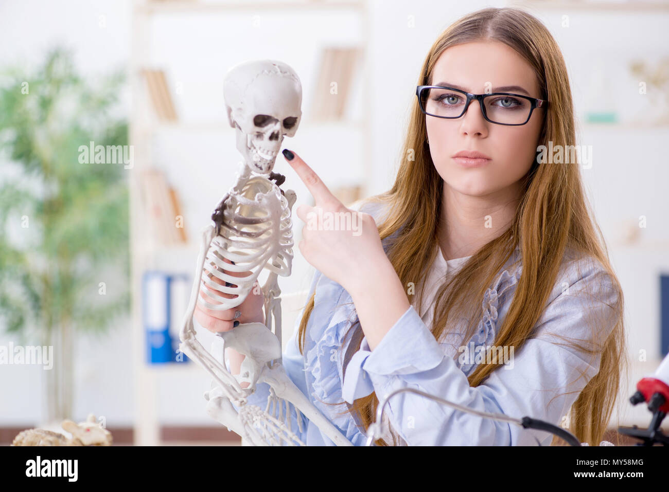 Student sitting in classroom and studying skeleton Stock Photo - Alamy