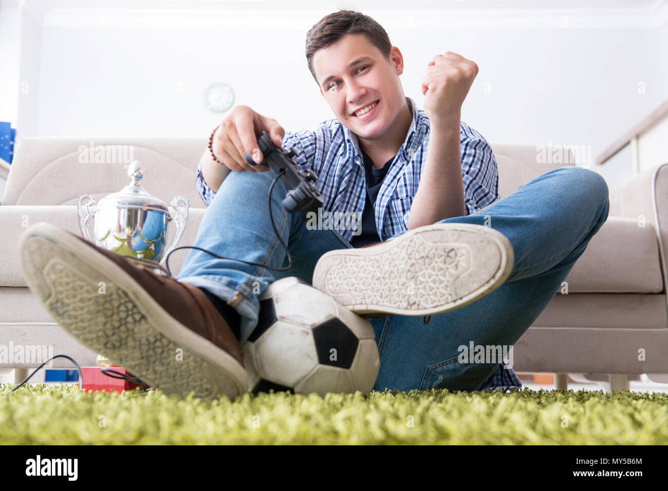 Young man playing computer games at home Stock Photo - Alamy
