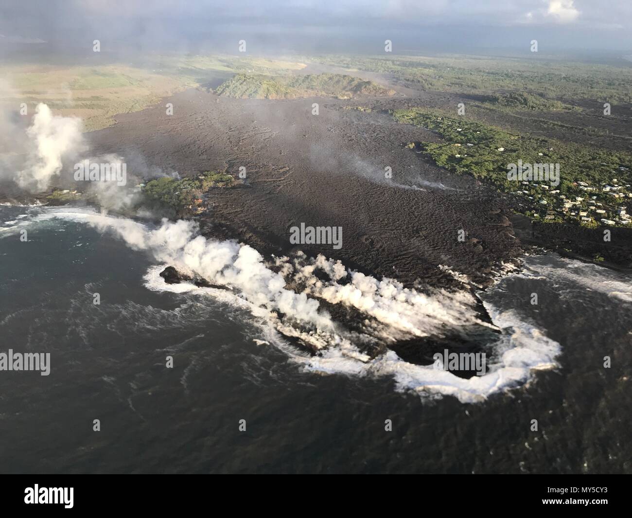 Lava flows into Kapoho Bay destroying forest and homes in the ...