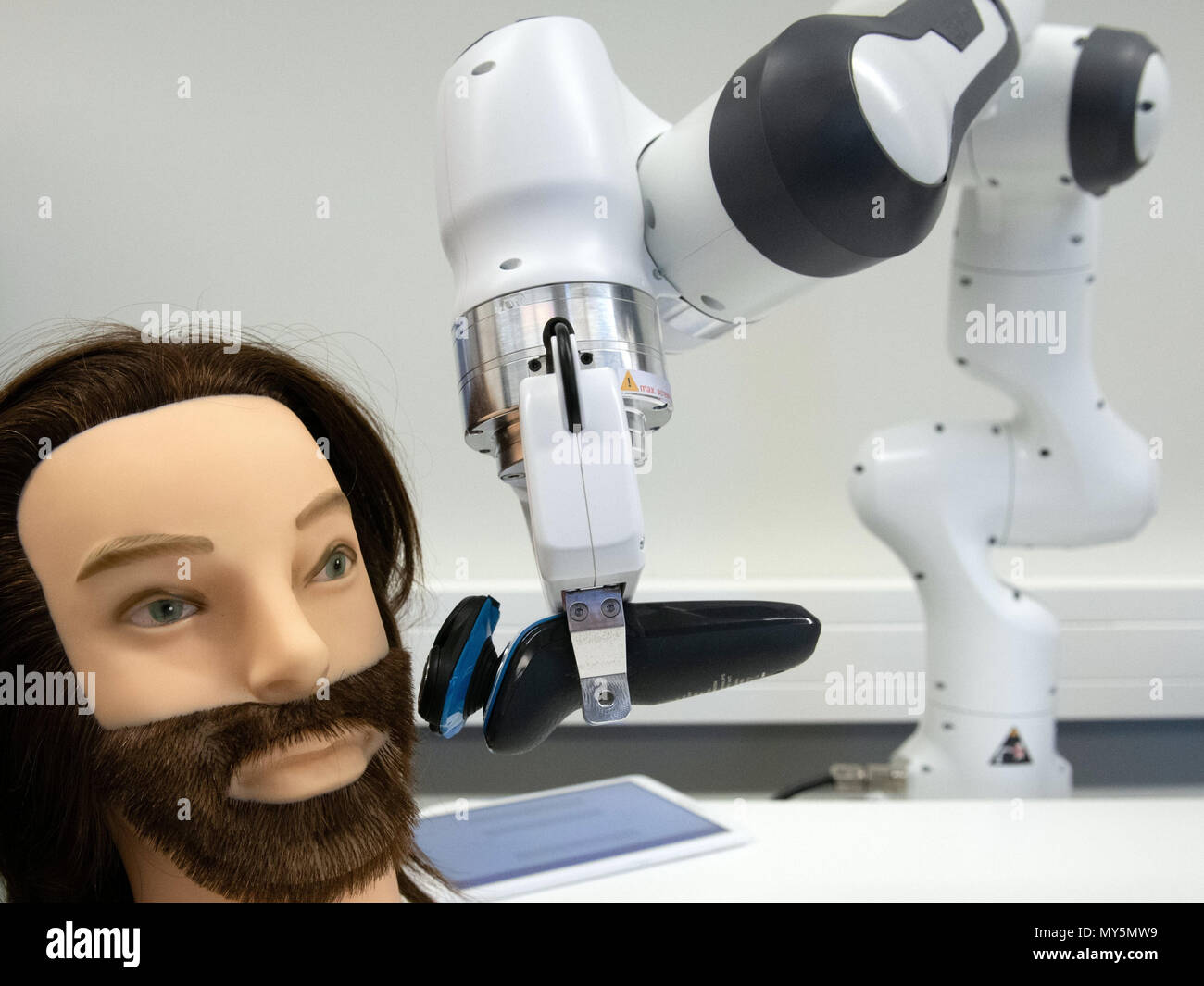 06 June 2018, Germany, Berlin: A robot arm for patient care and ...