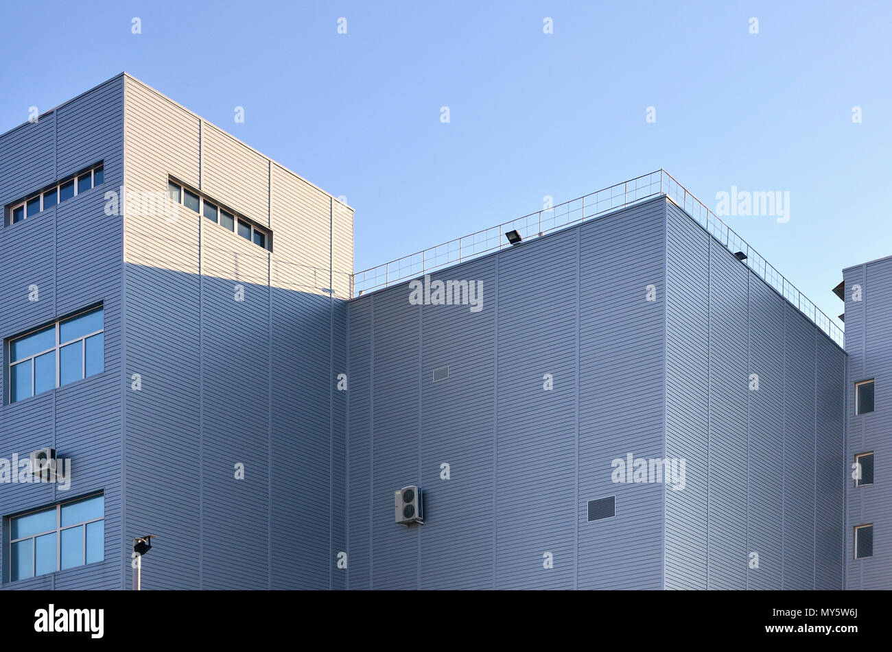 Photo of industrial high-rise building with perfect quality siding in ...